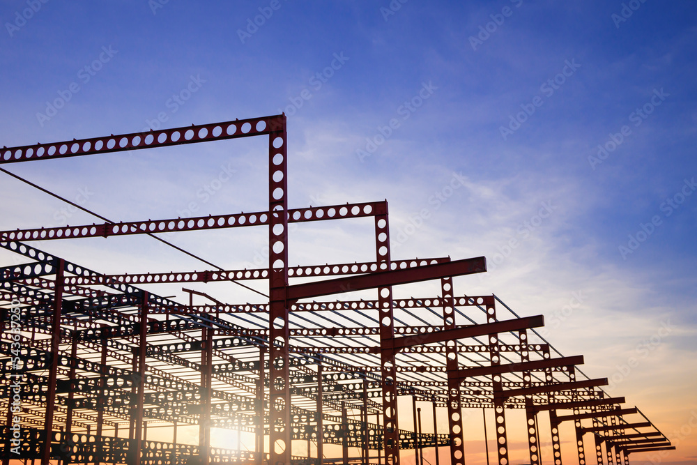 Silhouette of red castellated beam metal structure of large industrial ...