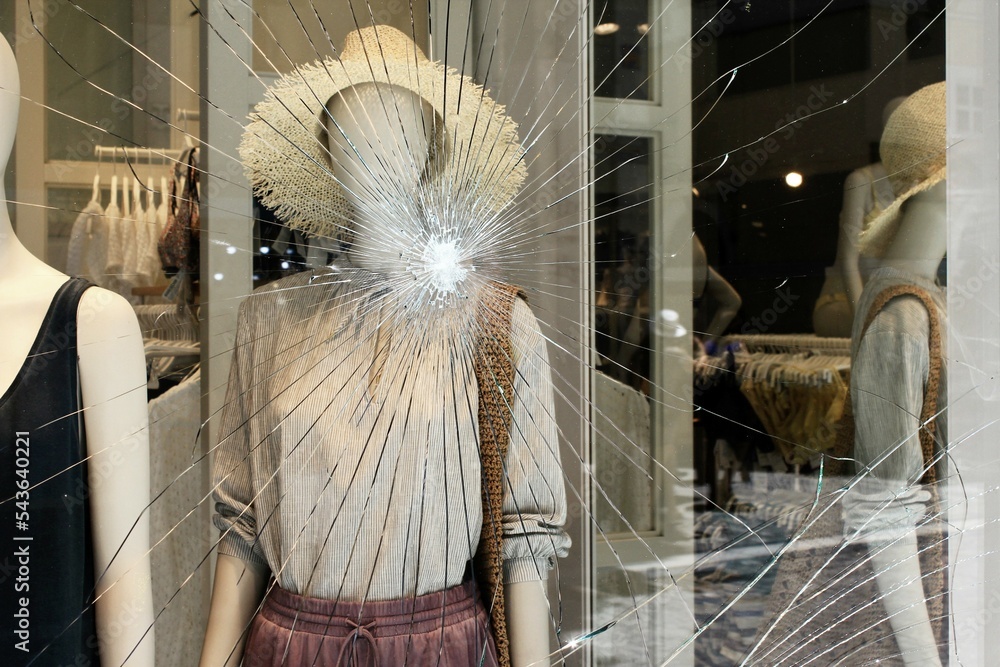 Broken glass of store window at Ermou street, in the commercial center ...