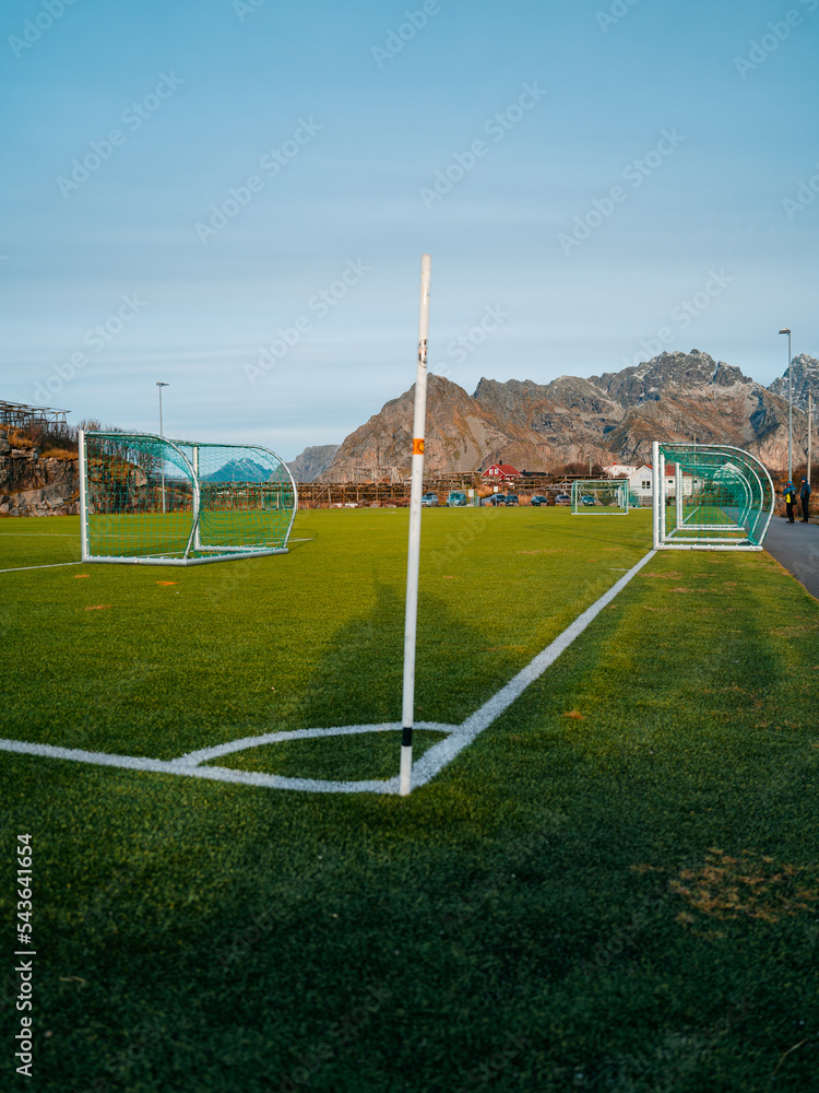 View over the Henningsvaer football stadium in Norway with the sea and ...