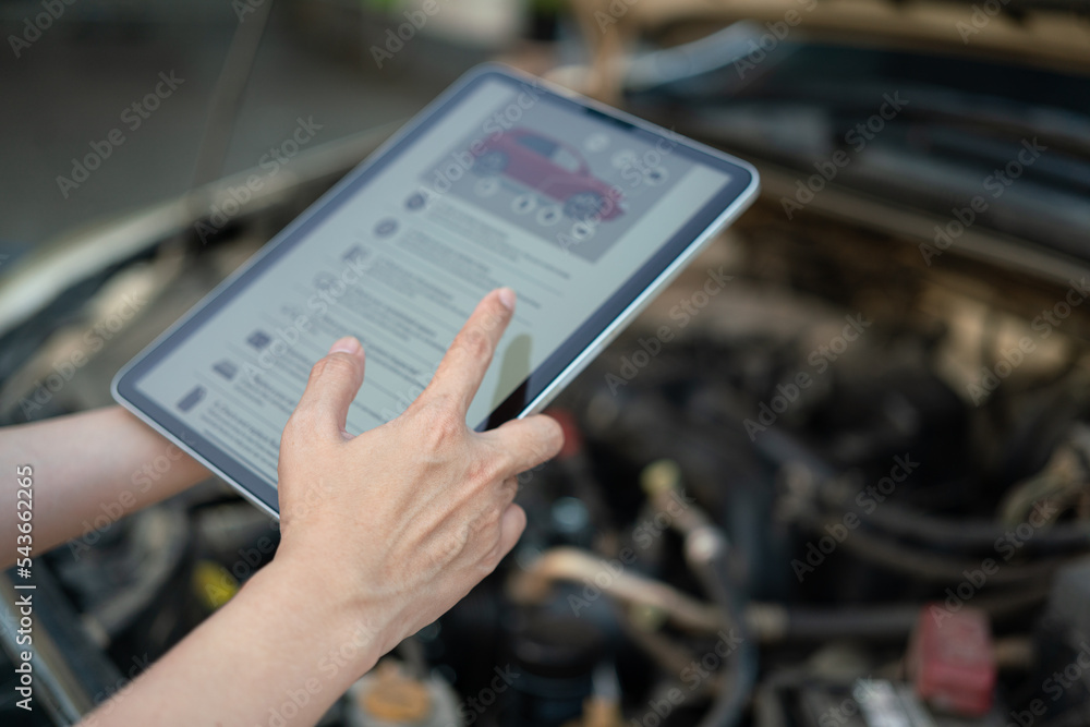 Using the vehicle checklist guideline on the digital tablet during ...