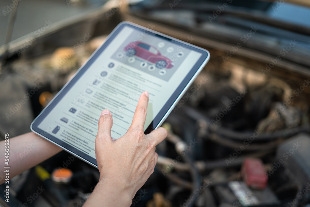 Using the vehicle checklist guideline on the digital tablet during ...