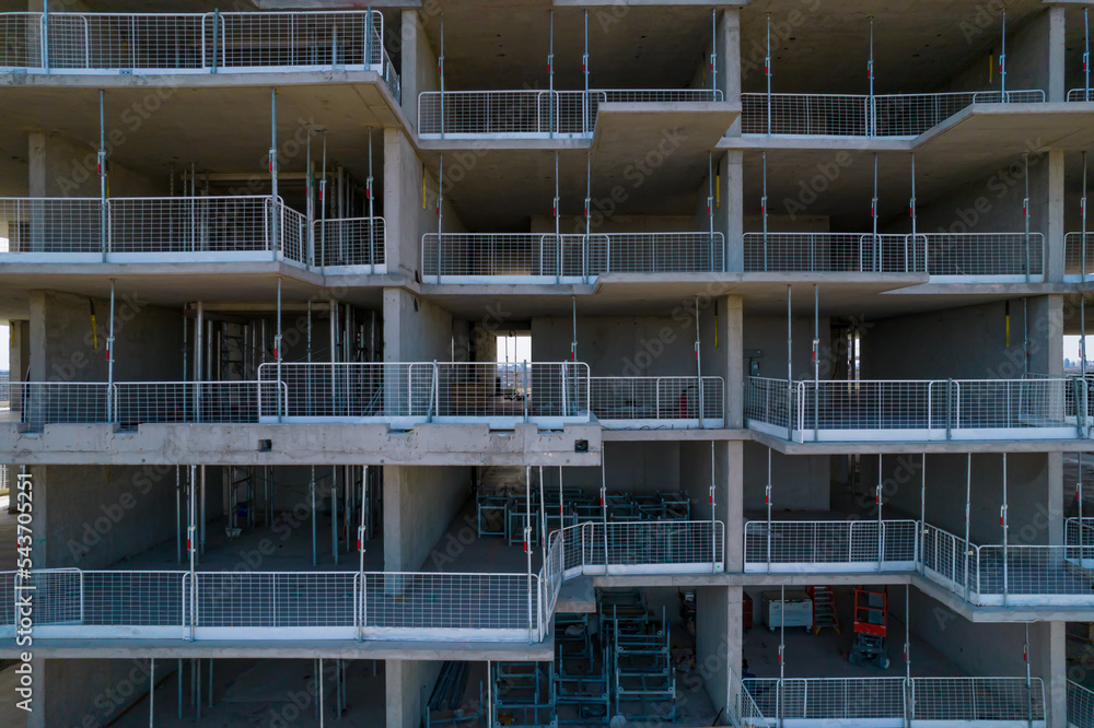 Empty construction site, incomplete high rise building with beams made ...