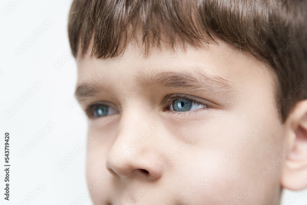 Eye health concept, young boy close up on white background, his healthy ...