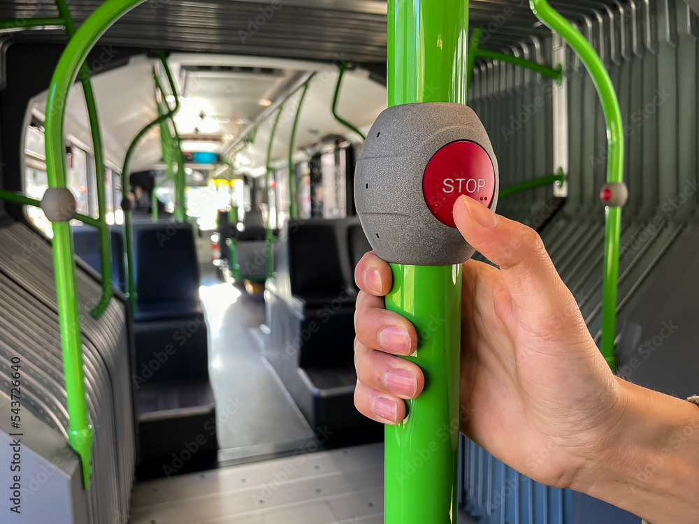 Stop request button in a modern public bus of the city transport ...
