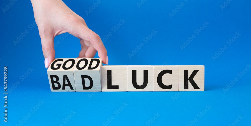 Good Luck and bad Luck symbol. Hand turns a cube and changes the words ...