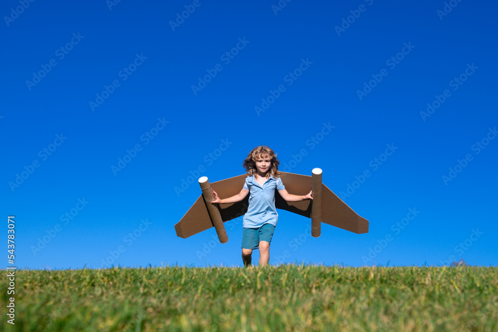 Dreams of travel. Child flying on jetpack with toy airplane on sky ...