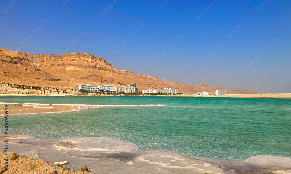 Ein Bokek resort on the Dead Sea in Israel. The majestic mountains of the Judean Desert, the ...
