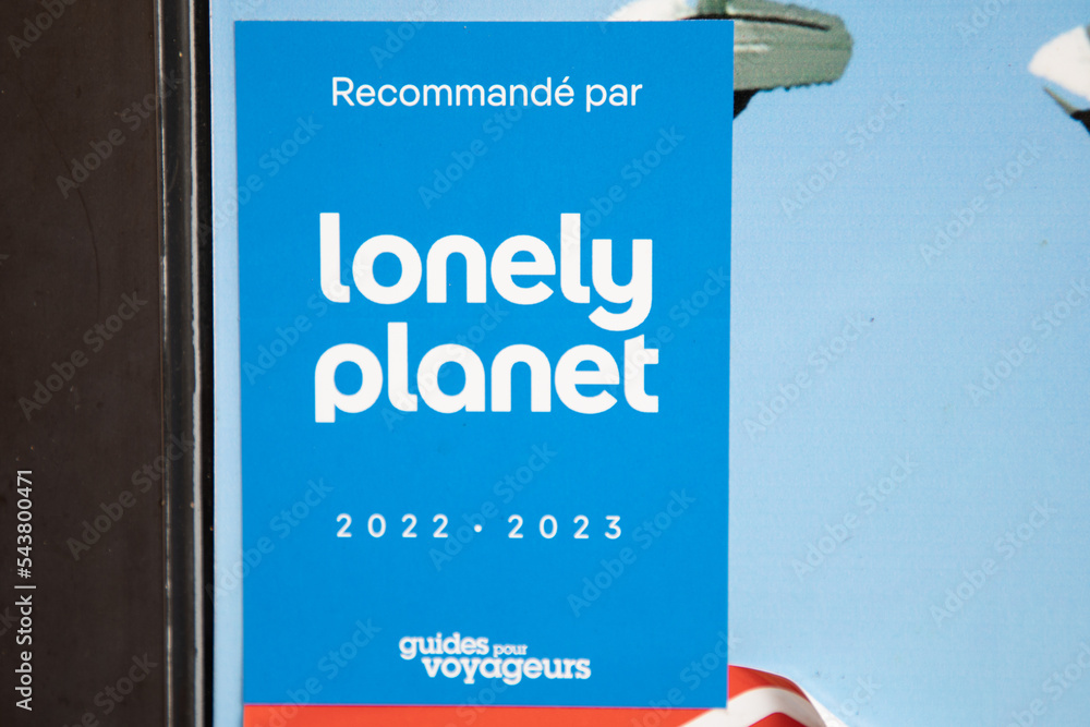 lonely planet 2022 2023 logo brand and sign text on shop windows store ...