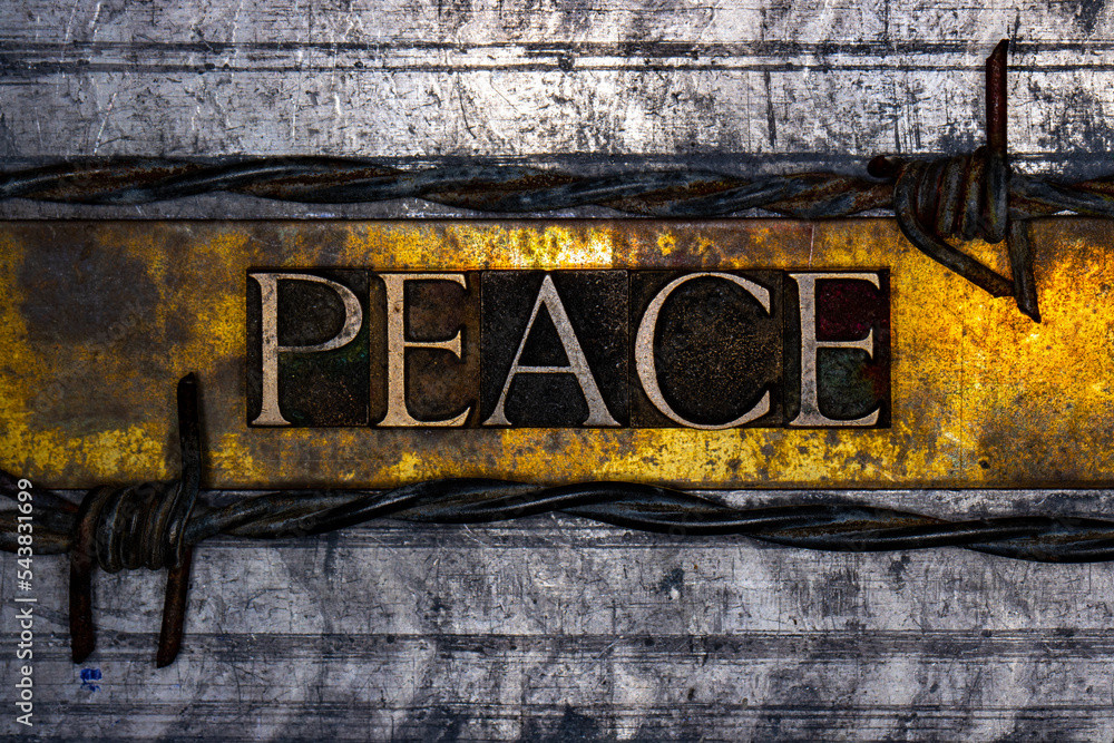 Peace text with barbed wire on grunge textured copper and gold ...