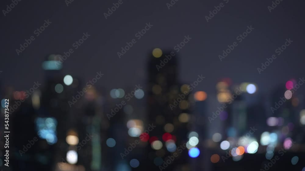 night cityscape view with skyscrapers lights bokeh defocused background ...