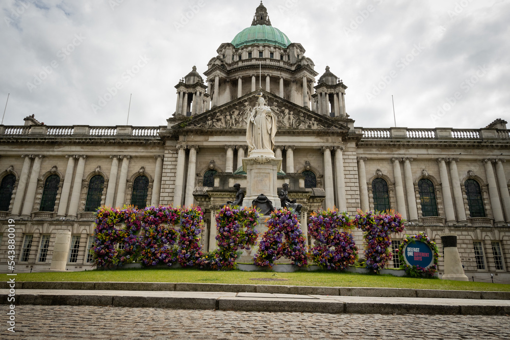The front of Belfast City Hall in the day time complete with floral ...