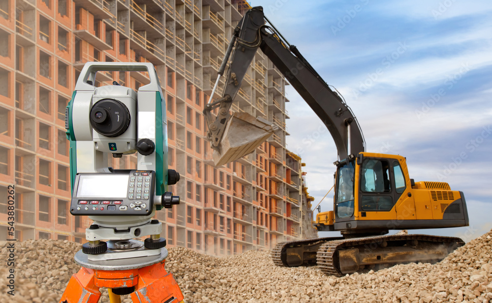 Geodetic in construction. Crawler excavator. Geodetic instrument ...