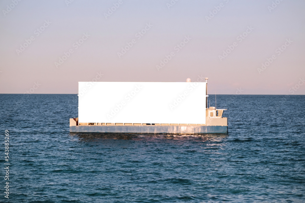 Boat with an advertising white billboard mock up floating on the sea ...