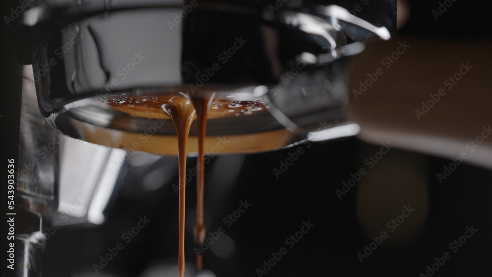 pull espresso shot with bottomless portafilter on a professional coffee ...