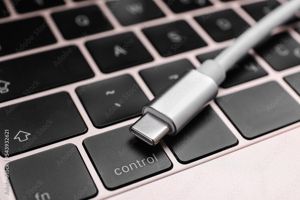 USB cable with type C connector on laptop keyboard, closeup Stock Photo ...