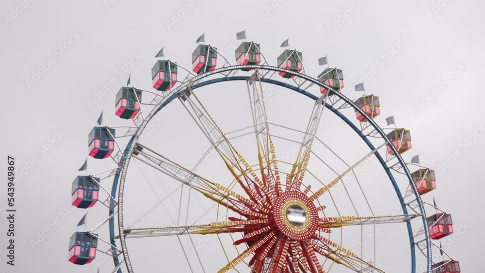 Amusement carnival, ferris wheel, wheel spinning. Colorful ferris wheel ...