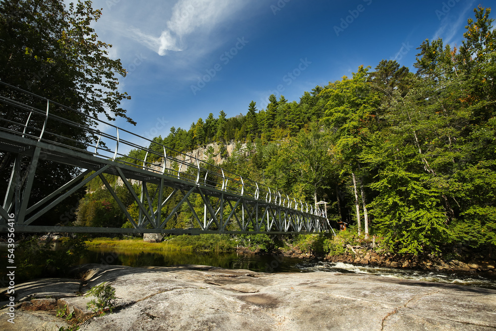 Bridge for hikers over the river, Marcotte waterfalls and at the ...