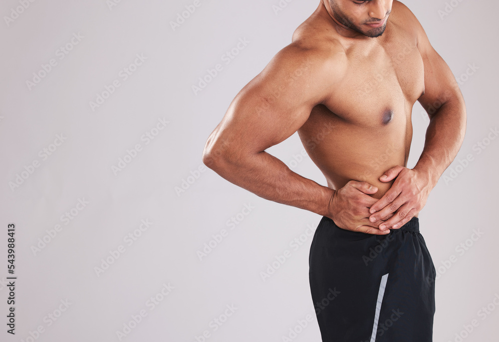 Fitness, sports and man with waist pain, topless in studio background ...