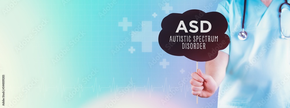 Autistic spectrum disorder (ASD). Doctor holding sign. Text is in ...