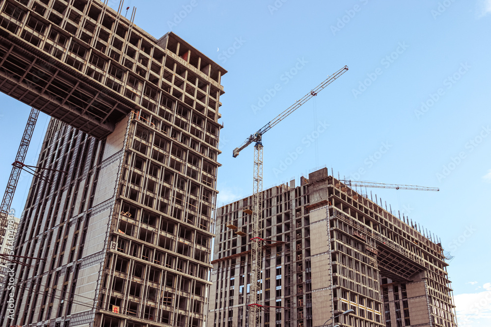 Construction site. Construction cranes and a building under ...