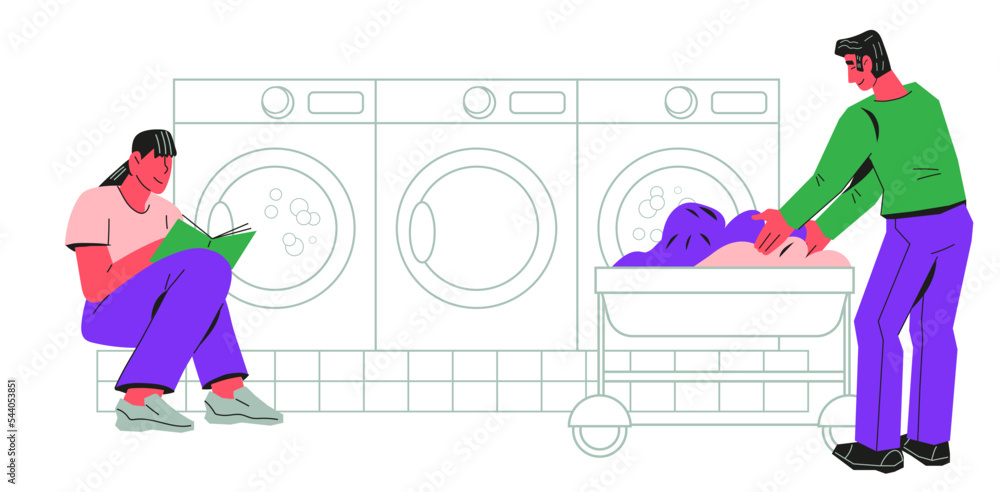 People in a public laundry, folding laundry into basket and washing ...