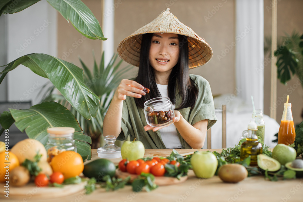Healthy food to boost your immune system. Beautiful smiling asian young ...