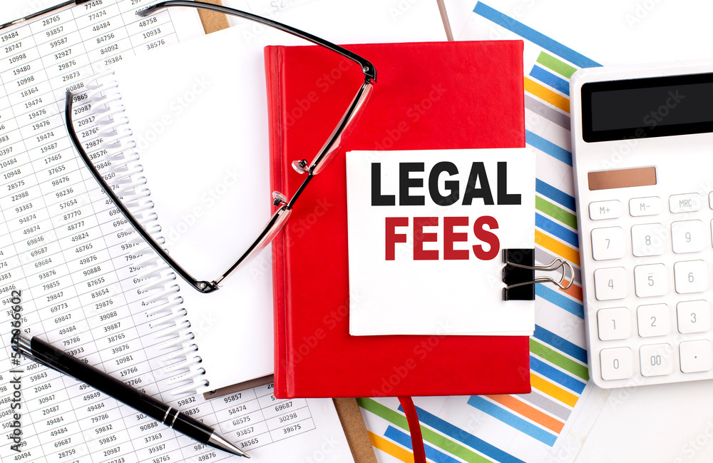 LEGAL FEES text on notebook with chart, calculator and pen Stock Photo ...
