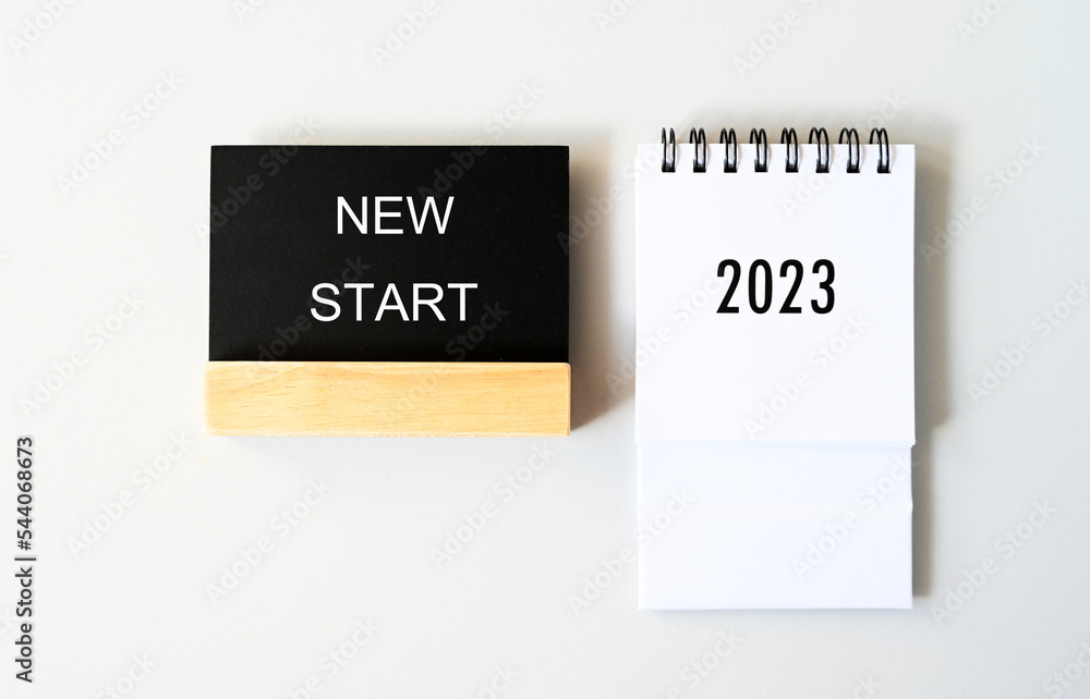 New start text 2023 and calendar 2023 on desk in modern office,New ...