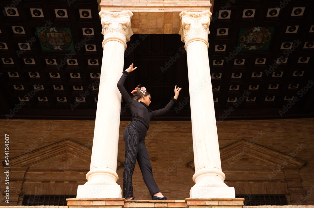 Beautiful teenage flamenco dancer with brown hair and dressed in dance ...