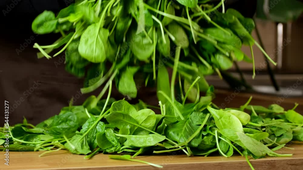 Spinach Leaves. Heap of Fresh organic spinach leaves on table. Cook ...