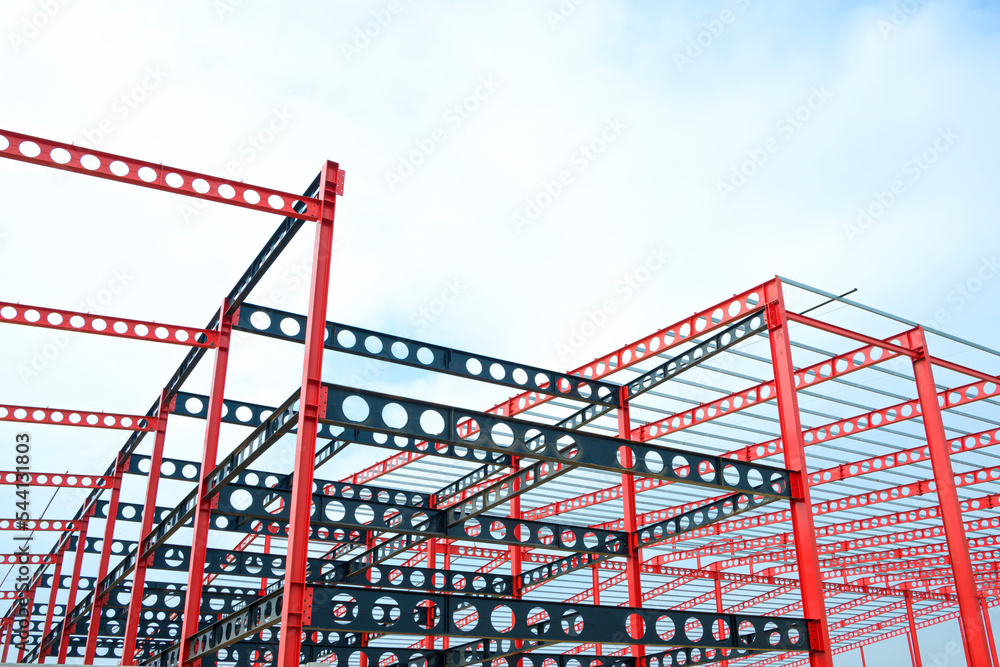 Red and black castellated beam metal structure of large industrial ...