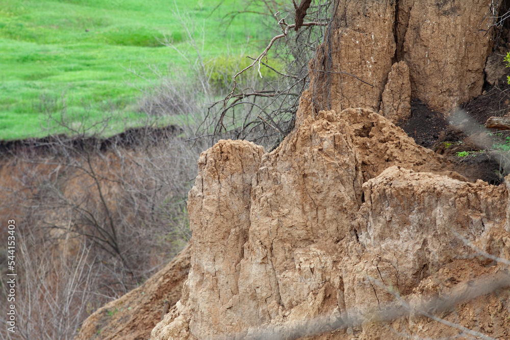 Soil erosion, sliding, and caving. Inside the landslide is rock ...