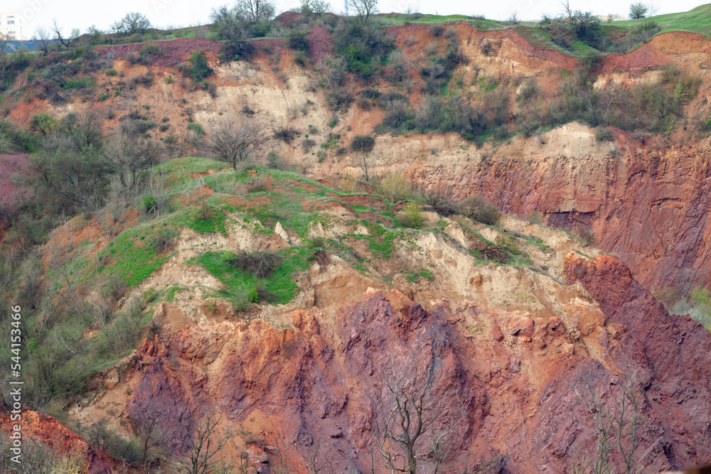 Soil erosion, sliding, and caving. Inside the landslide is rock ...