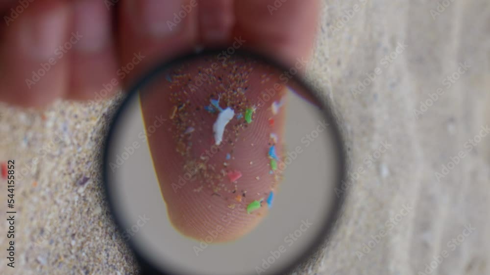 Close up shot of microplastics in hands vertical video. micro plastics ...