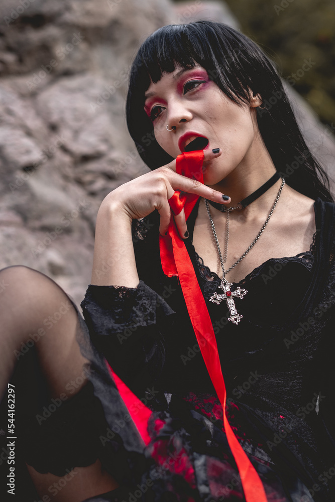 Zdjęcie Stock: Young, sexy and vampiric hispanic goth girl with black ...