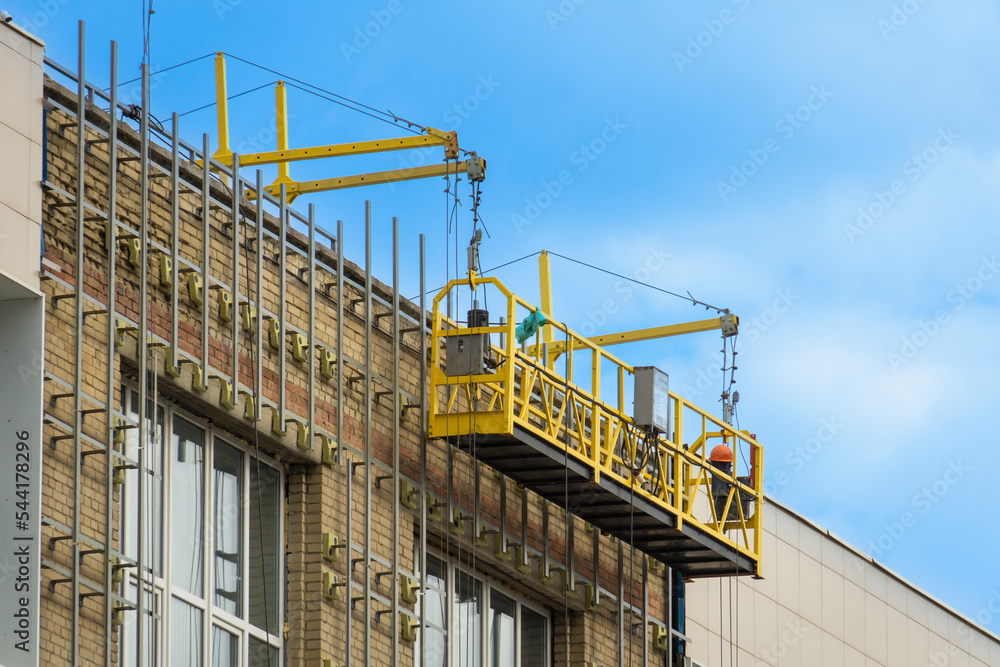 Cabin of the front elevator on cables. Facing the facade of the ...