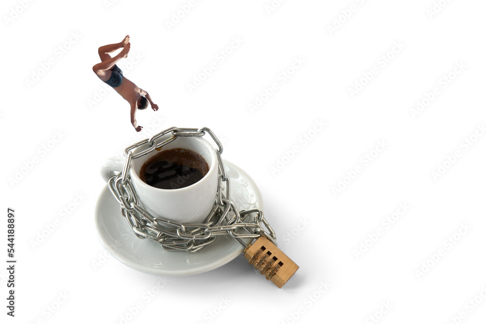 Coffeeholic. A young man dives into a cup with a drink. The cup is ...