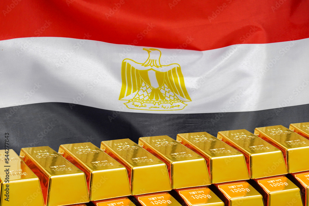 Row of shining golden bullions on the Egypt flag background. Business ...