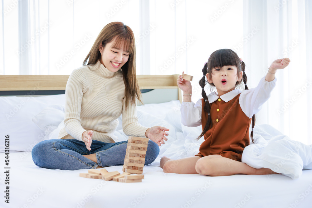 Asian young teenage female mother nanny babysitter in casual sweater ...