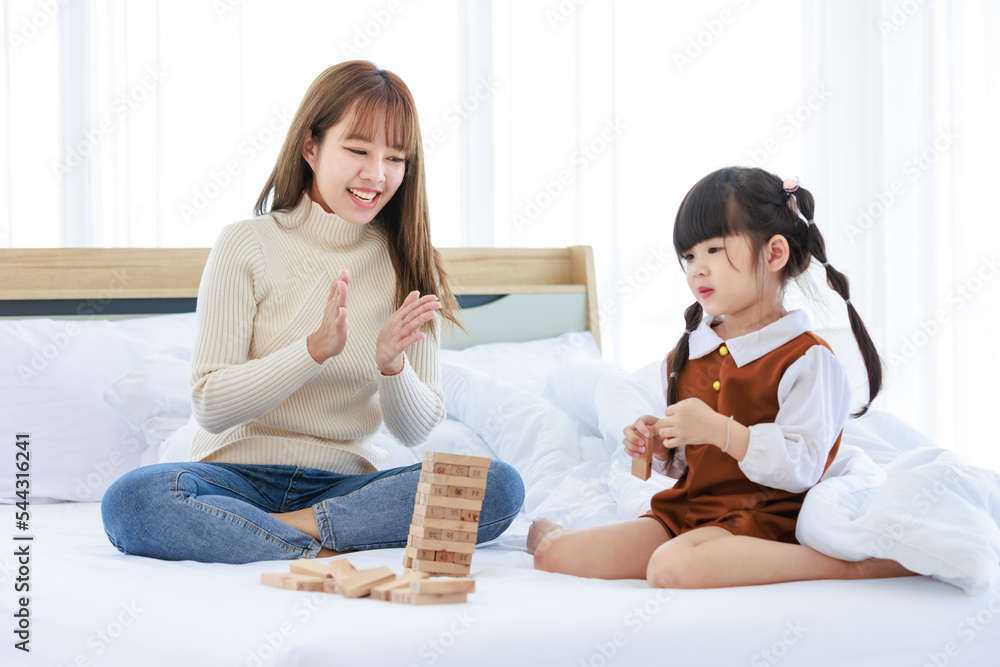 Asian young teenage female mother nanny babysitter in casual sweater ...