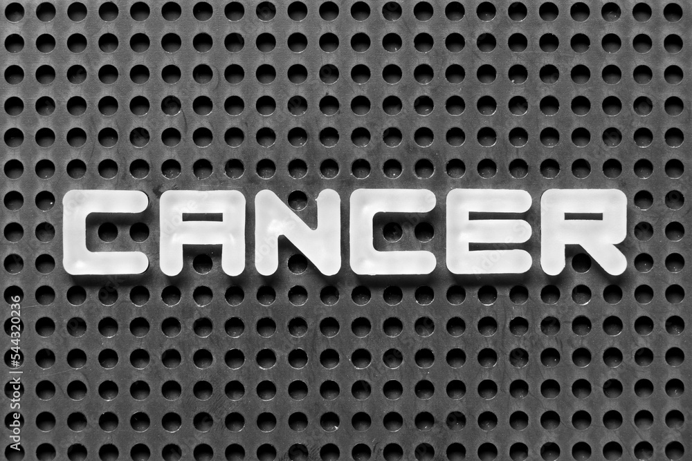 White alphabet letter in word cancer on black pegboard background Stock ...