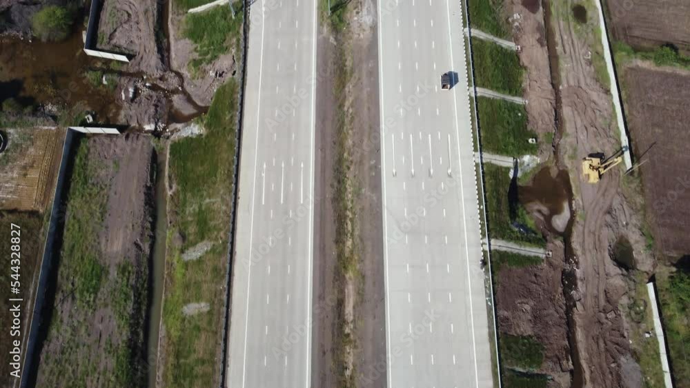 Tilt-up revealing drone shot of the Interchange of Samruddhi Mahamarg ...