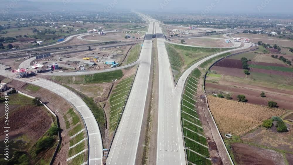 Revealing back aerial drone shot of the Interchange of Samruddhi ...