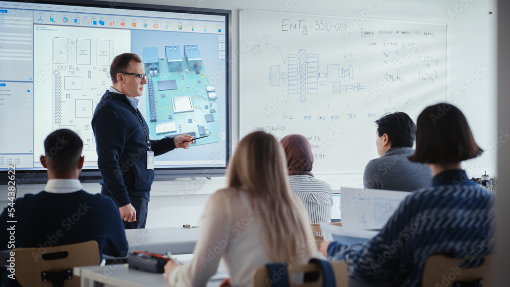 Confident Male Teacher Using Digital Interactive Screen, Talks to Group ...