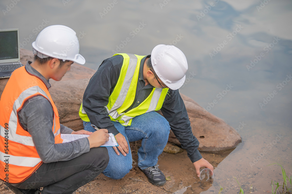 Environmental engineers inspect water quality,Bring water to the lab ...
