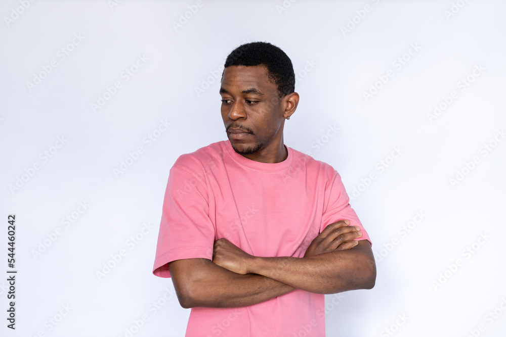 Portrait of unhappy African American man crossing arms. Dissatisfied ...