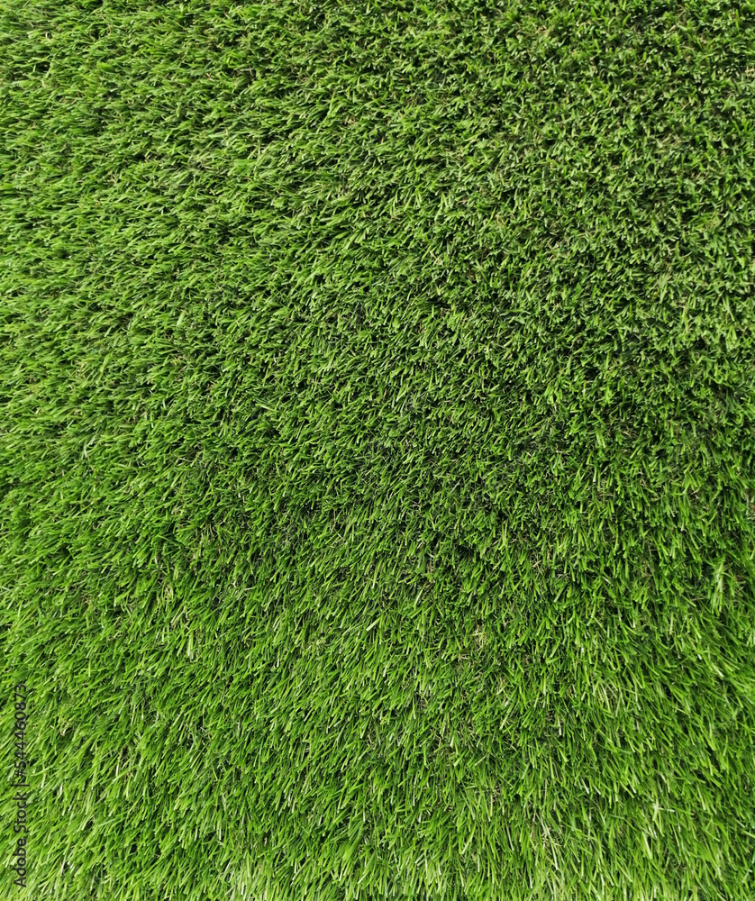 Fondo con detalle y textura de superficie de cesped en tonos verdes ...