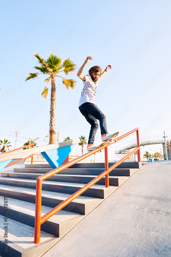 Professional skater doing trick in skate park in sunlight. Stock Photo ...