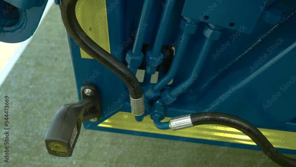 Block of connecting hydraulic rubber hoses to metal pipes of the main ...