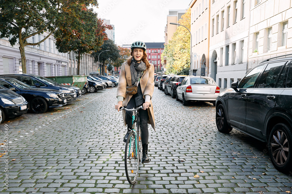 Woman on her bike Stock Photo | Adobe Stock